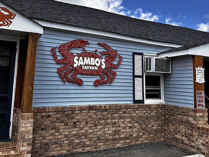 The iconic red crab sign against blue clapboard isn't just decoration—it's a beacon of deliciousness calling to hungry seafood lovers across Delaware.