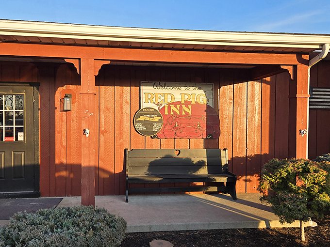 The Red Pig Inn's barn-red exterior isn't just a color choice—it's a promise of the smoky treasures waiting inside this unassuming Ottawa landmark.