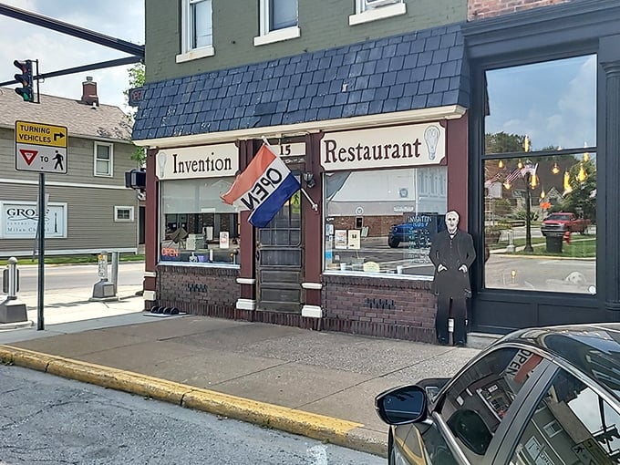 The iconic facade of Invention Restaurant, where a Thomas Edison cutout stands guard, reminding visitors they're about to experience some truly illuminating comfort food.