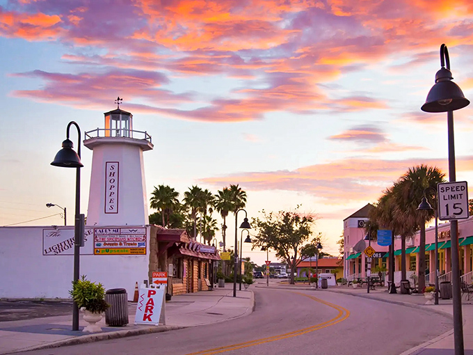 Sunset paints the sky over Tarpon Springs' iconic lighthouse, where Greek heritage meets Florida charm in a postcard-perfect coastal scene.