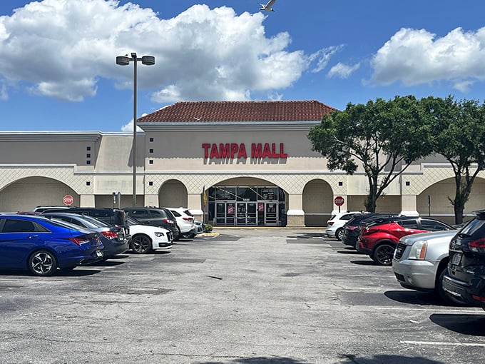 The Spanish-style roof and bold red signage of Tampa Mall beckons bargain hunters like a lighthouse for the fiscally responsible.
