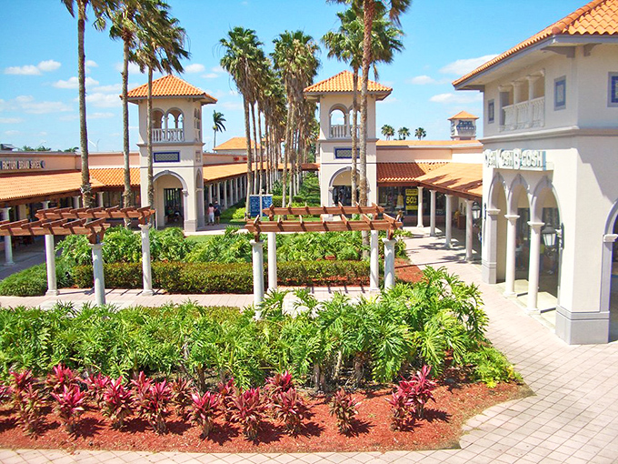 Mediterranean meets Florida at this coral-roofed shopping paradise. Palm trees stand guard as shoppers embark on their bargain-hunting adventures.Mediterranean meets Florida at this coral-roofed shopping paradise. Palm trees stand guard as shoppers embark on their bargain-hunting adventures.