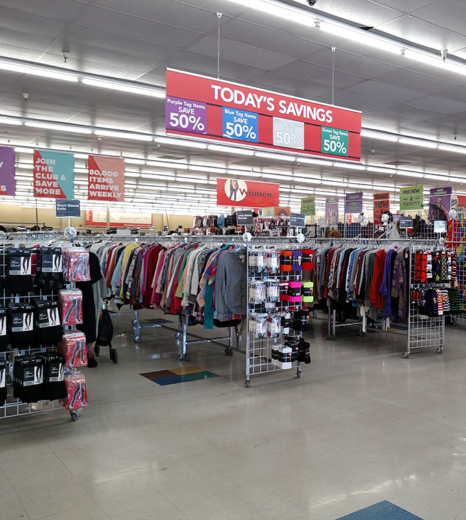 Color-coded savings beckon shoppers to racks of potential treasures – where yesterday's fashion becomes tomorrow's unique find at half price.