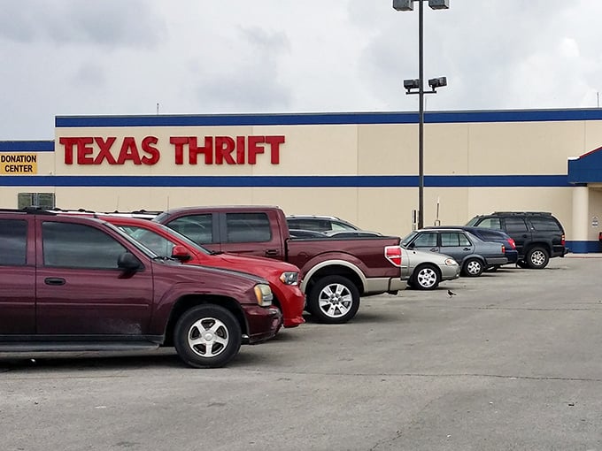 The bold red letters of Texas Thrift beckon like a siren song to bargain hunters. This unassuming exterior hides a universe of possibilities within.