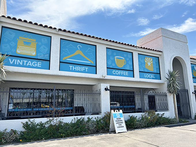 The Spanish-style exterior with its vibrant blue window panels promises treasures inside – like a stylish friend who always delivers on their promises.