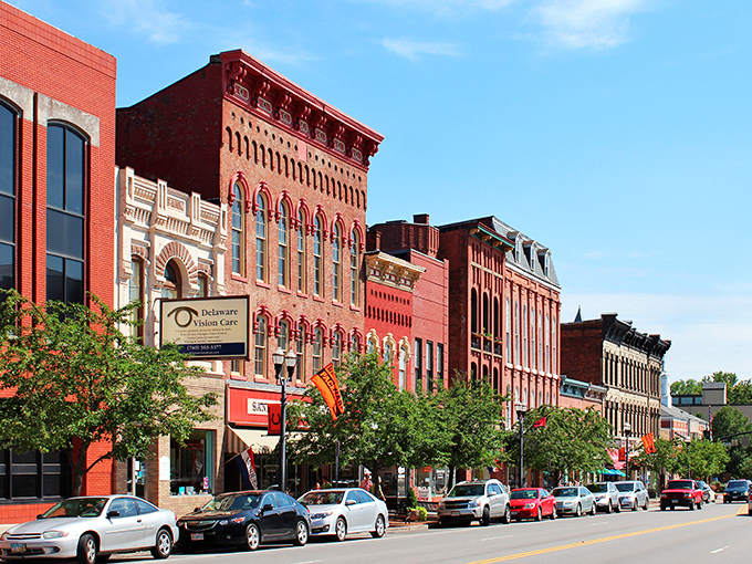 Downtown Delaware's historic brick buildings stand like old friends sharing stories across generations, their warm red facades glowing in the afternoon sun.
