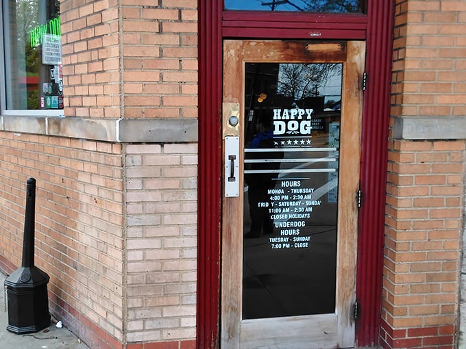 The unassuming brick corner building houses culinary magic within. Like Clark Kent's phone booth, this humble exterior transforms ordinary hot dogs into superheroes of flavor.