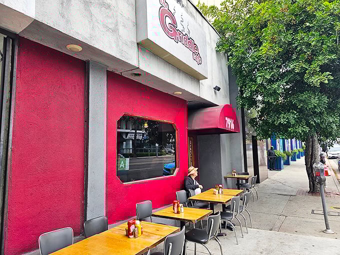 That unassuming red storefront holds breakfast secrets that would make your grandmother weep with joy. 