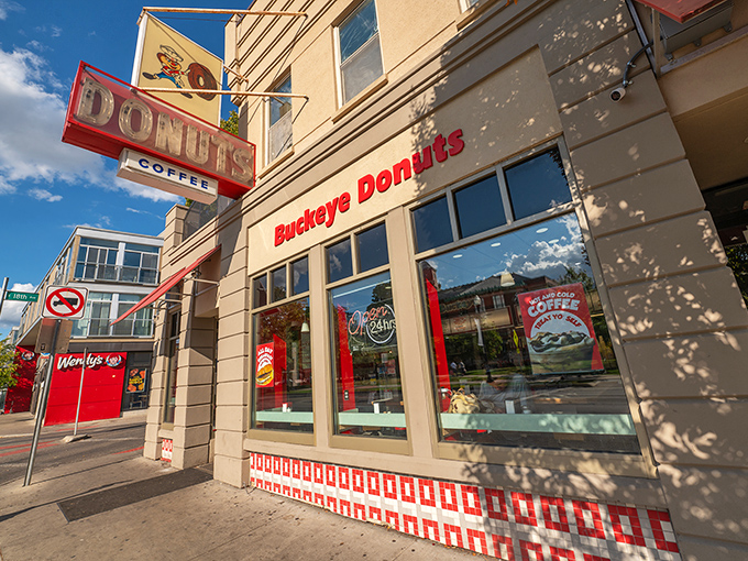 The iconic red and white storefront of Buckeye Donuts stands like a beacon of sugary hope on North High Street, promising delicious salvation 24 hours a day.