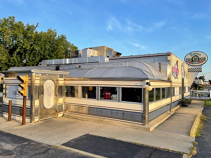 This gleaming silver beauty sits like a chrome-plated promise of breakfast perfection on Main Street.