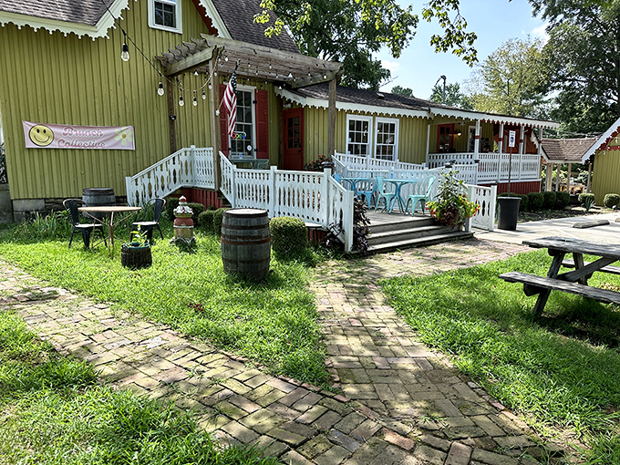 The storybook green cottage with its white picket fence isn't just charming—it's practically begging you to come in and loosen your belt a notch.