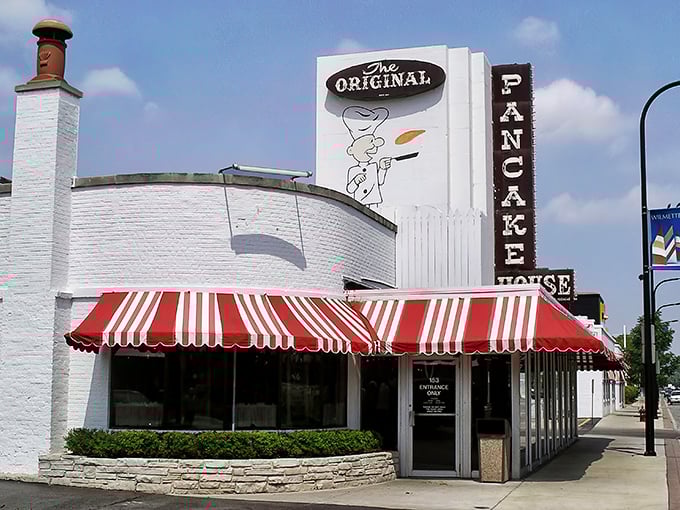 The iconic red and white awning of Walker Bros. beckons like a breakfast lighthouse guiding hungry souls to pancake paradise.
