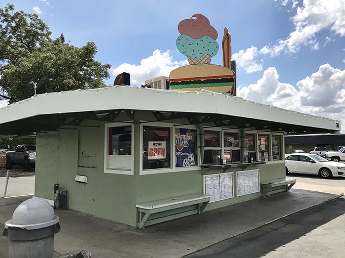 That mint-green time capsule with the burger-and-ice-cream crown isn't trying to be retro—it just never stopped being itself. Pure California roadside magic.