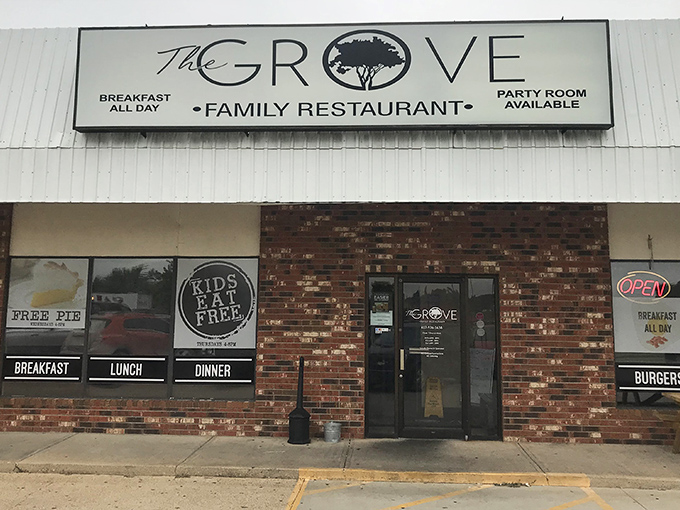 The unassuming brick facade of The Grove Family Restaurant hides culinary treasures within. That "FREE PIE" sign isn't just decoration—it's a promise of sweet things to come.