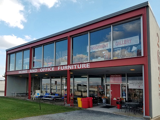 The iconic red-trimmed façade beckons like a siren song to treasure hunters. Inside awaits a wonderland of pre-loved possibilities.