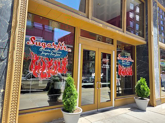 The golden-framed entrance to Sugarfire beckons like a portal to meat paradise. Those flames on the logo? A delicious warning of what's to come.