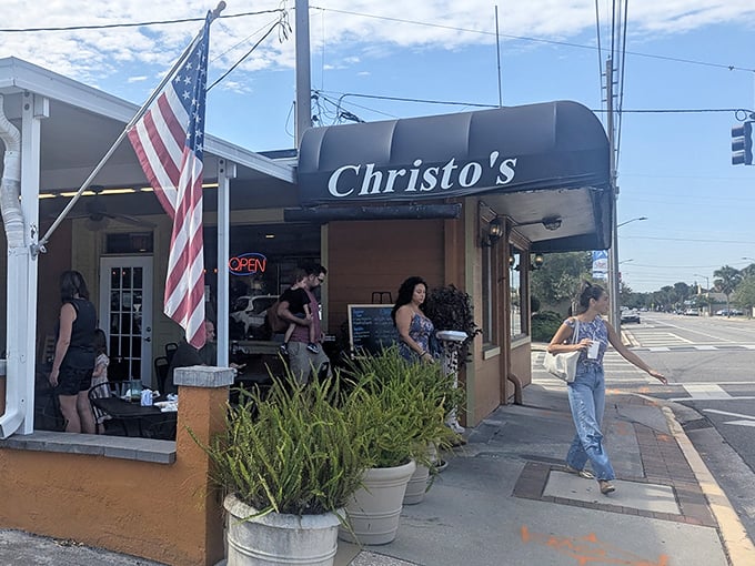The unassuming orange exterior of Christo's Café stands like a beacon of breakfast hope on Edgewater Drive, palm trees standing guard over this Orlando treasure.