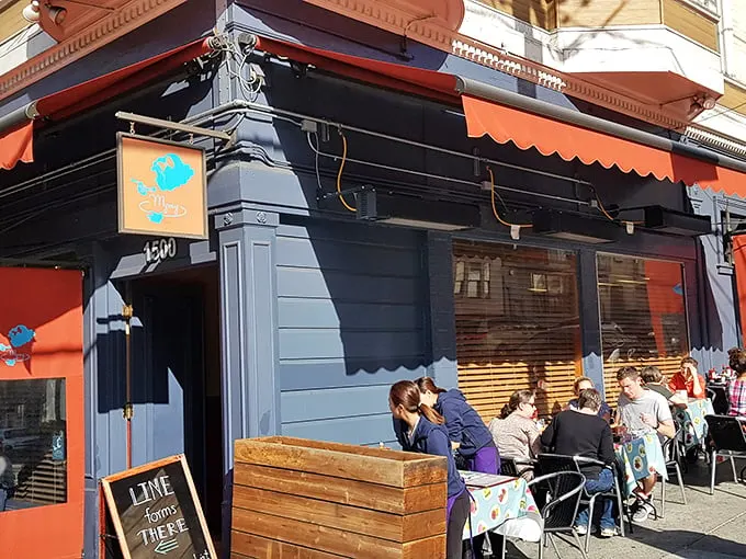 The unassuming exterior that hides San Francisco's best-kept breakfast secret behind its modest red awning.