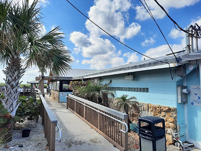 Blue skies, palm trees, and a weathered turquoise building – JB's Fish Camp isn't trying to impress you with flash. The seafood inside handles that job perfectly.