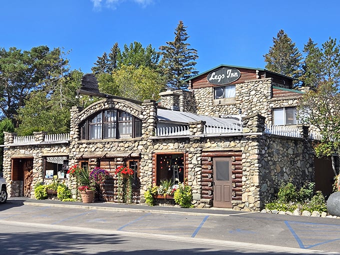 Stone walls that tell stories, upside-down stove legs that defy gravity—this isn't just a restaurant, it's a Michigan folk art masterpiece watching over Lake Michigan.