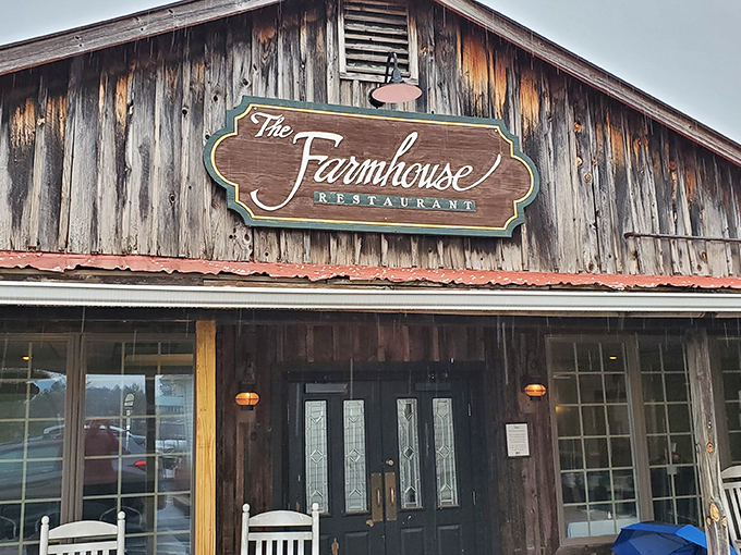 The weathered wooden exterior and white rocking chairs aren't just charming – they're the first clue you've found a true Virginia treasure.
