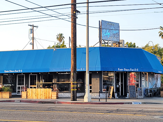 That iconic blue awning stands as a beacon of barbecue bliss on Lincoln Boulevard, calling hungry pilgrims to worship at the altar of smoke.