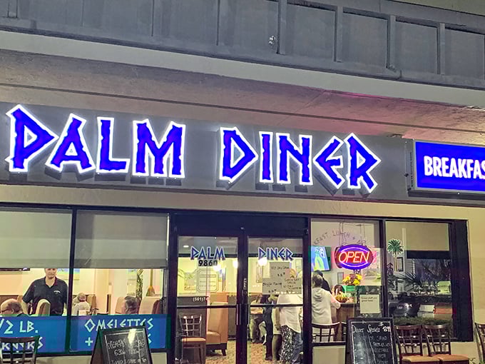 The iconic blue lettering of Palm Diner stands out like a beacon for hungry travelers. This Boynton Beach institution promises three square meals and seafood that's worth the trip.