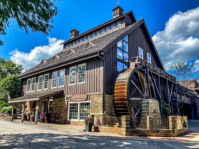 The historic Ye Olde Mill stands proudly against an Ohio blue sky, its wooden water wheel ready to churn—much like they've been churning ice cream since 1914. 
