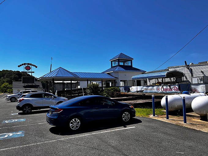 The iconic roadside sign beckons like a siren call to seafood lovers – Captain Billy's stands ready to welcome hungry travelers to crab paradise.