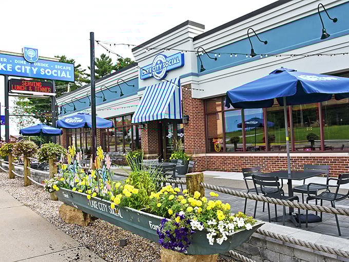 Blue skies and blue awnings welcome you to Lake City Social, where flower boxes burst with color like Wisconsin summer itself.