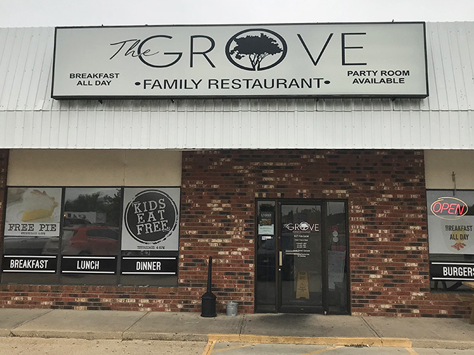 The unassuming brick facade of The Grove Family Restaurant hides culinary treasures within. That "FREE PIE" sign isn't just decoration—it's a promise of sweet things to come.