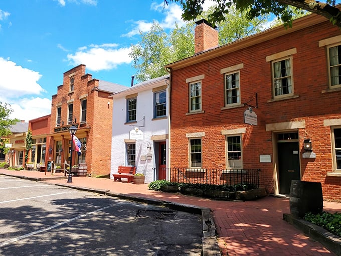 Modern cars parked along historic brick streets create a delightful time-traveling paradox in downtown Roscoe Village.