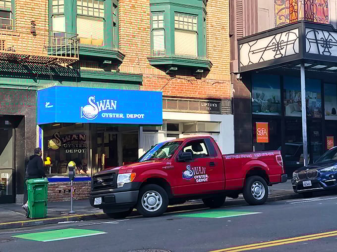 The iconic blue awning of Swan Oyster Depot – San Francisco's seafood institution where time stands deliciously still on Polk Street.