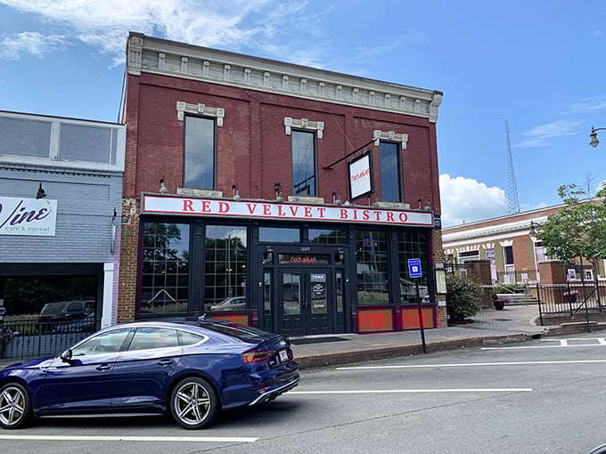 The historic brick façade of Red Velvet Bistro beckons hungry travelers with its classic charm and promise of Southern comfort within.
