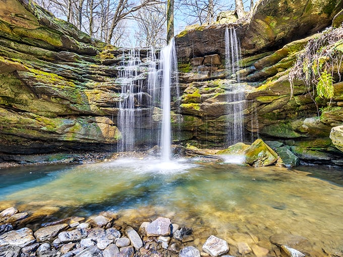 The main attraction delivers on its promise: layered sandstone cliffs where water gracefully cascades into a crystal-clear pool. Mother Nature showing off again.