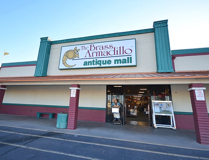 The unassuming exterior hides a universe of treasures within. Like a time-travel portal disguised as a strip mall storefront, the Brass Armadillo beckons.