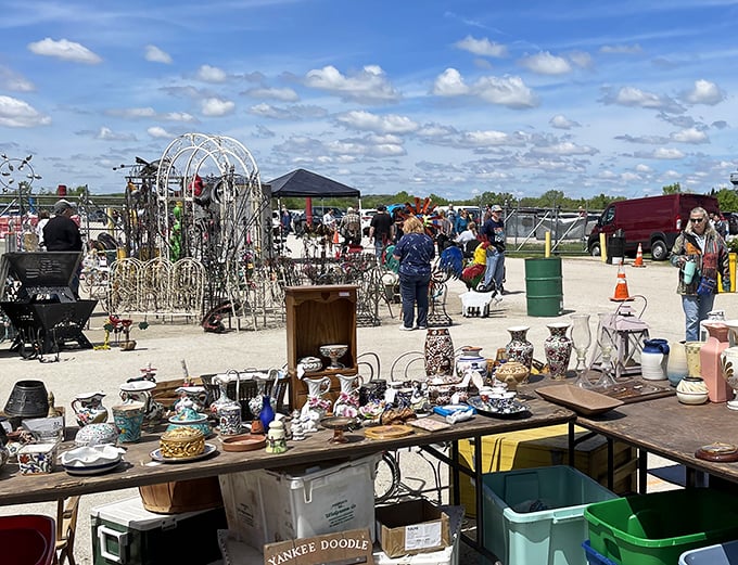 A treasure hunter's paradise stretches before you – tables laden with potential discoveries under the vast ceiling of possibility. Every aisle promises its own adventure.