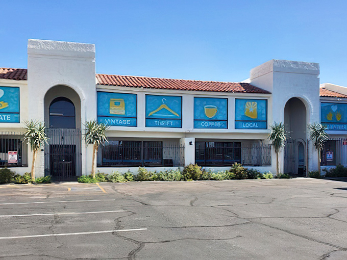 The pristine white exterior of Thrift to Thrive beckons like a siren song to bargain hunters. Those blue window panels aren't just decorative—they're portals to treasure hunting paradise.