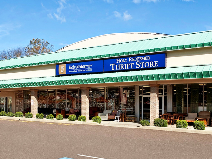 The storefront beckons with its distinctive green-trimmed roof and bold blue signage – like a beacon for bargain hunters with discerning taste.