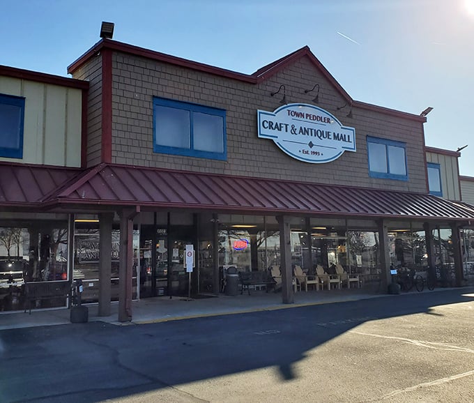The unassuming exterior of Town Peddler belies the treasure trove within—like finding a portal to the past disguised as a strip mall storefront.