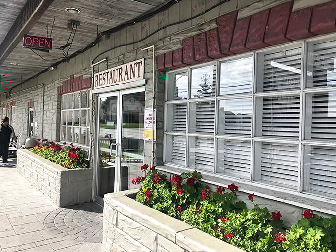 The unassuming exterior of Dienner's Country Restaurant beckons hungry travelers with its simple charm and promise of authentic Amish cooking that's worth the journey.