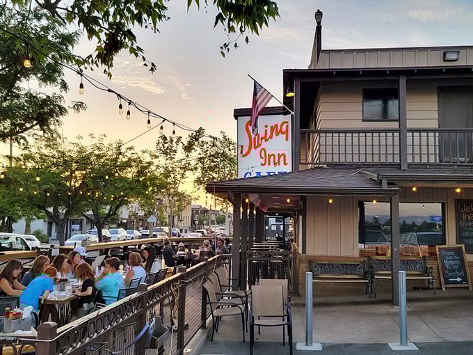 The Swing Inn's rustic wooden facade and vintage orange sign stand as a time capsule in Temecula's Old Town, beckoning hungry travelers with promises of smoky delights.