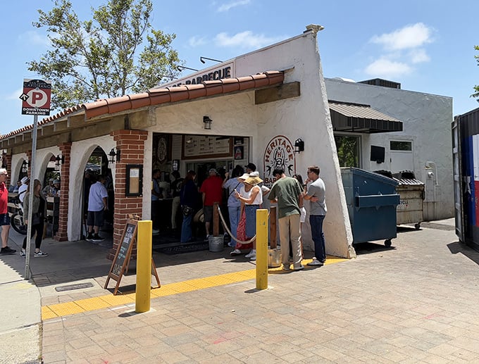 The pilgrimage begins here: Heritage Barbecue's modest Spanish-style exterior belies the smoky treasures within. Yellow bollards guide the faithful.