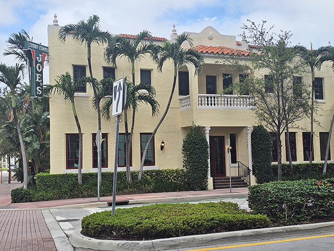 The cream-colored Mediterranean Revival building stands like a culinary lighthouse on Washington Avenue, promising seafood salvation to all who enter.