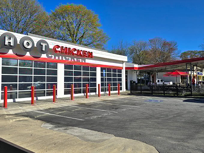The bold red "HOT CHICKEN" sign isn't just advertising—it's a warning and a promise. This unassuming building houses flavor explosions waiting to happen.