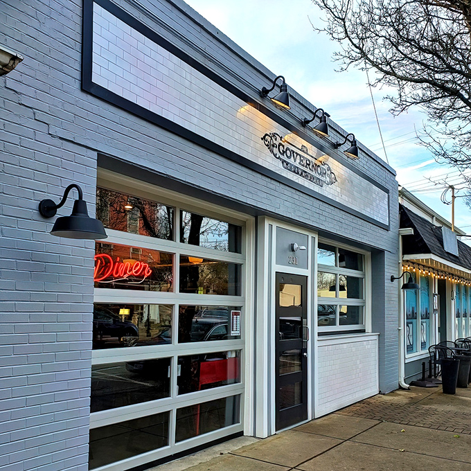 The Governor's crisp white exterior and inviting patio seating create the perfect small-town vibe on Milford's charming Main Street.