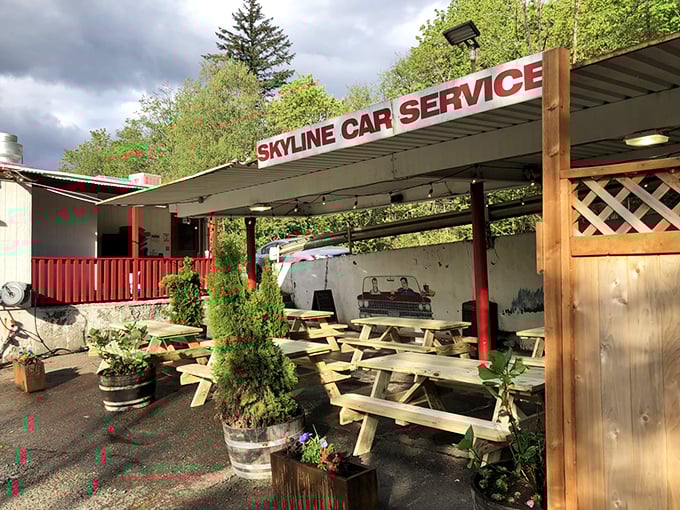 Nestled among towering evergreens, Skyline Restaurant's classic white-and-red exterior promises comfort food nirvana that time forgot—in the best possible way.