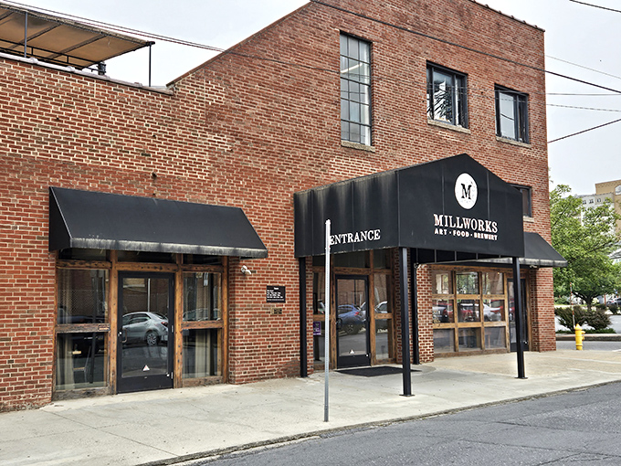 The sturdy brick exterior of The Millworks stands as Harrisburg's culinary fortress, where the "ART-FOOD-BREWERY" promise beckons hungry explorers inside.