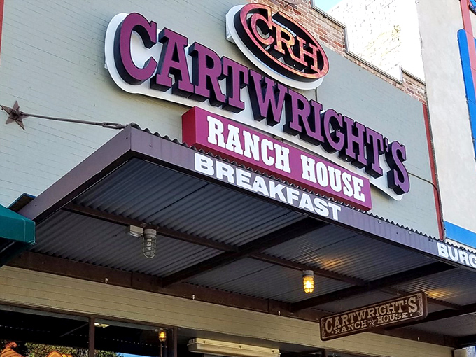 The purple sign beckons like a Texas-sized promise – Cartwright's Ranch House isn't just a restaurant, it's a declaration of comfort food devotion.