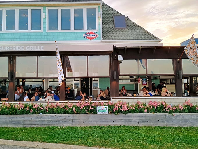 The aqua-colored exterior of Waterman's stands like a coastal beacon, promising seafood treasures within its unassuming beach house façade.
